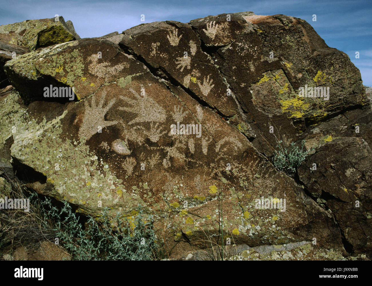 Pueblo carvings of a bird and human hands on Comanche Gap volcanic dyke ...