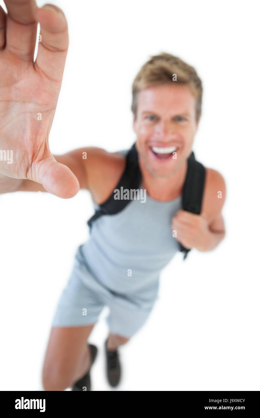Man trying to grab the camera on white background Stock Photo - Alamy