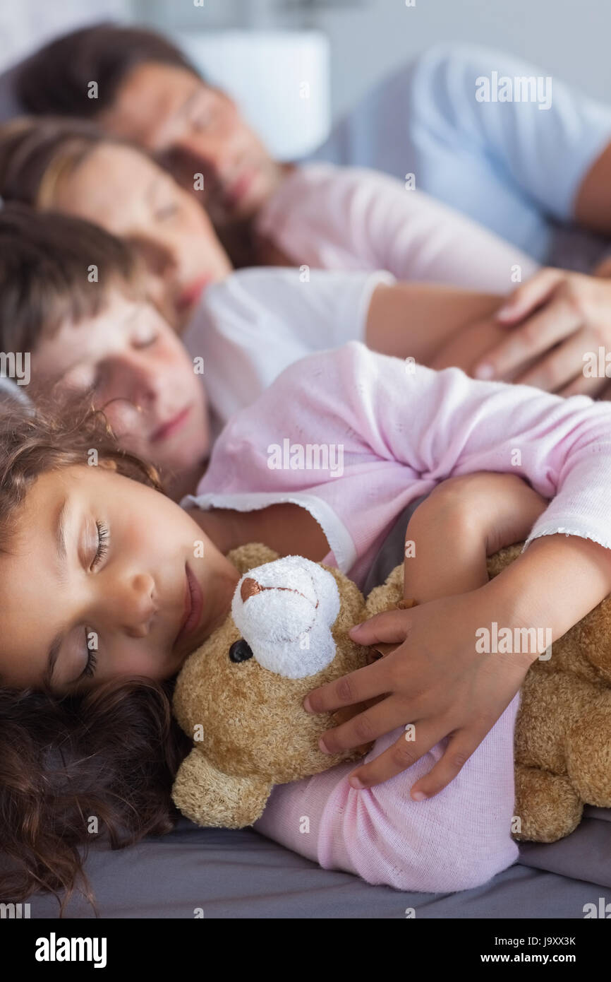Cute family napping together in bed Stock Photo - Alamy
