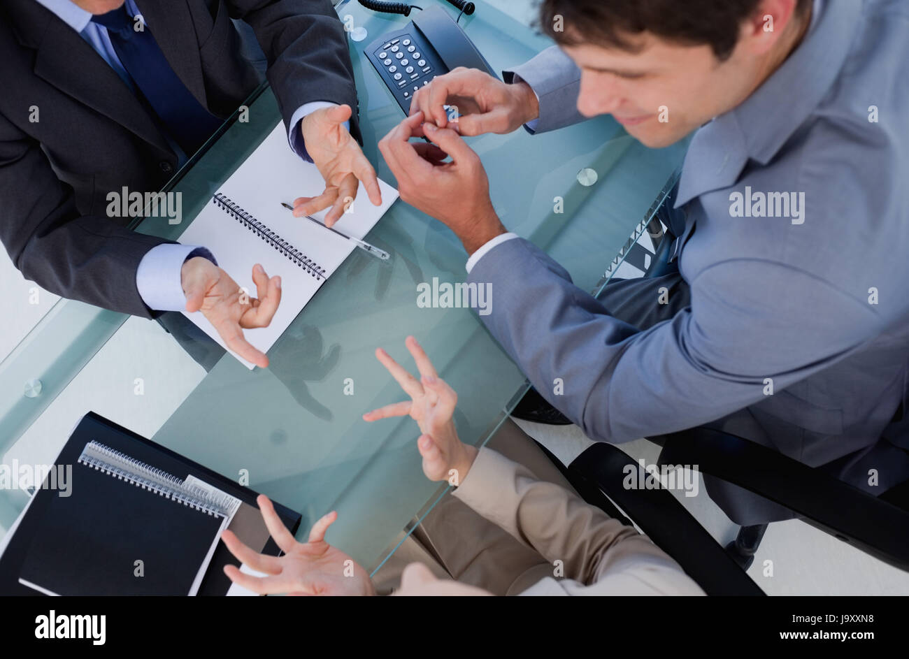 Above view of a business team having a meeting in an office Stock Photo ...