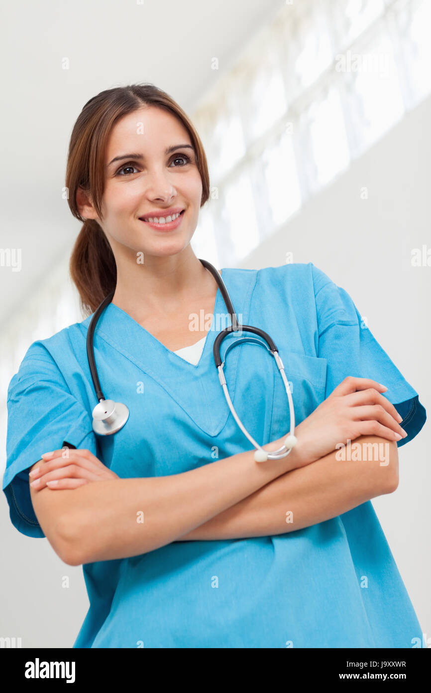 Female doctor folding arms hi-res stock photography and images - Alamy