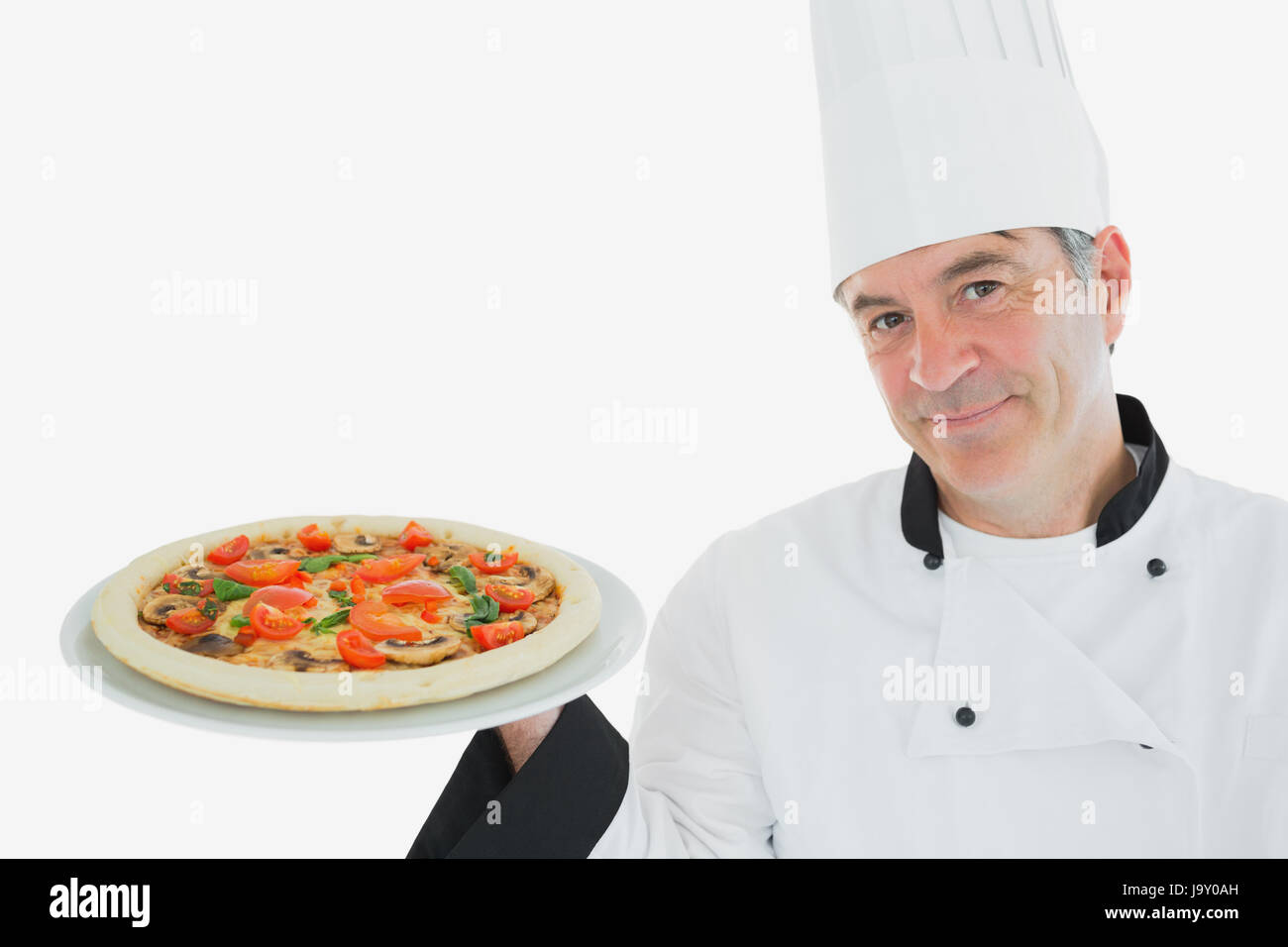 Portrait of happy chef holding delicious pizza over white background ...