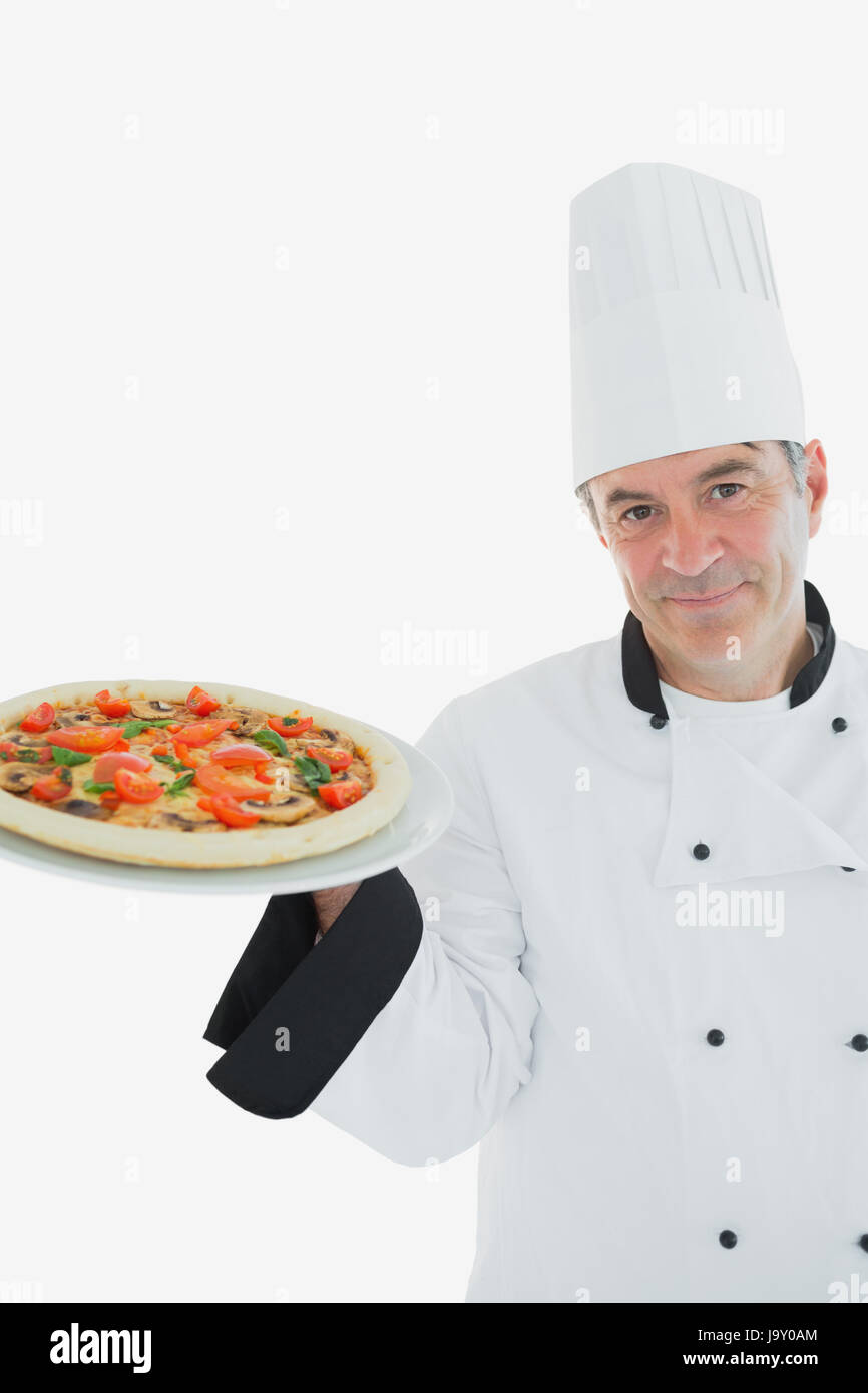 Portrait of male chef holding pizza over white background Stock Photo ...