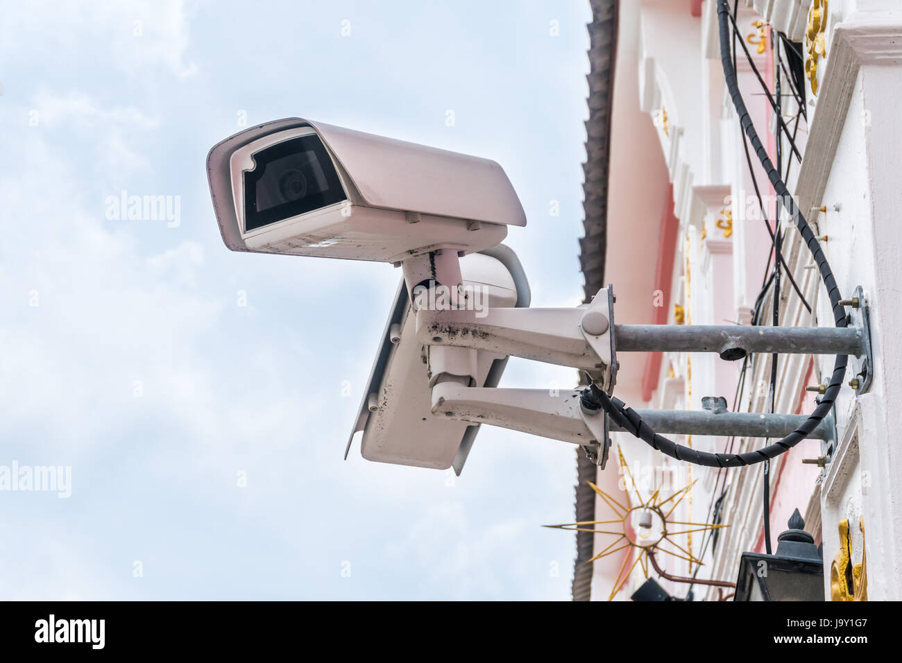 Closed Circuit Television camera isolated on white building background ...