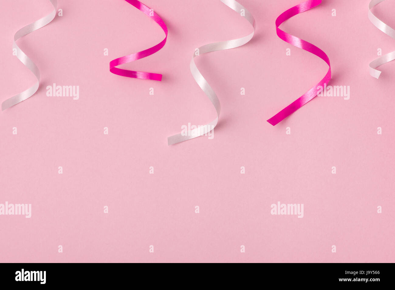 Delicate pink ribbons party background for celebrating Stock Photo - Alamy