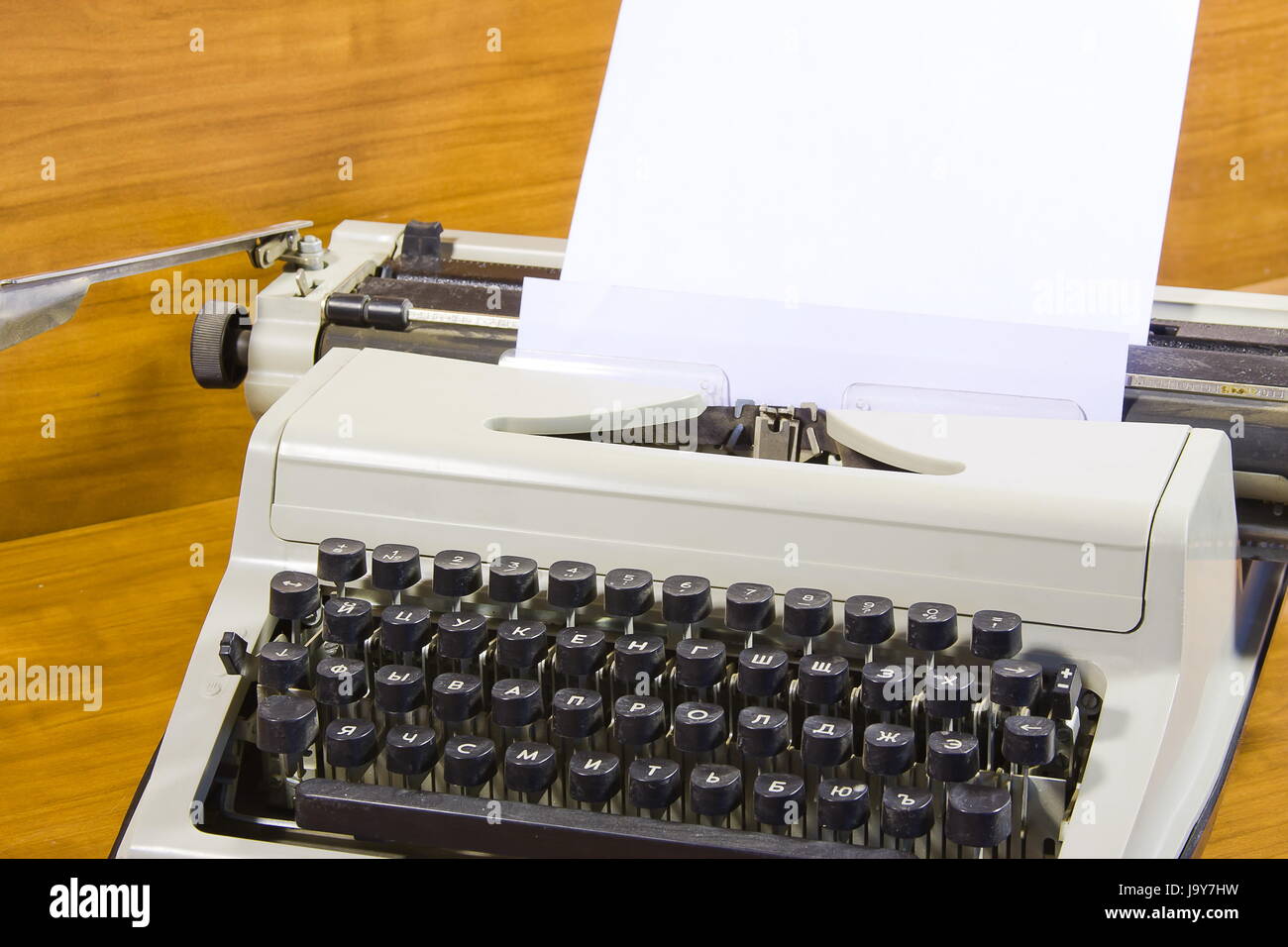 old typewriter and clean sheet of paper Stock Photo - Alamy