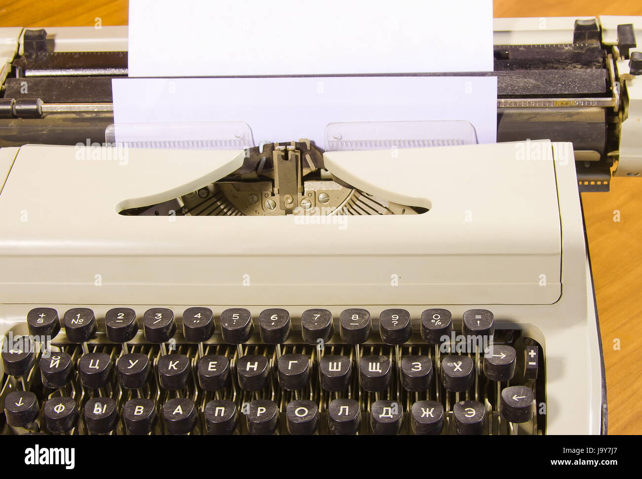 old typewriter and clean sheet of paper Stock Photo - Alamy