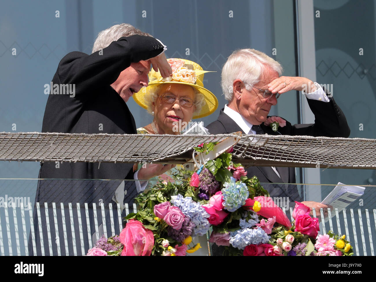 Queen Elizabeth II with her racing manager John Warren on Derby Day of ...