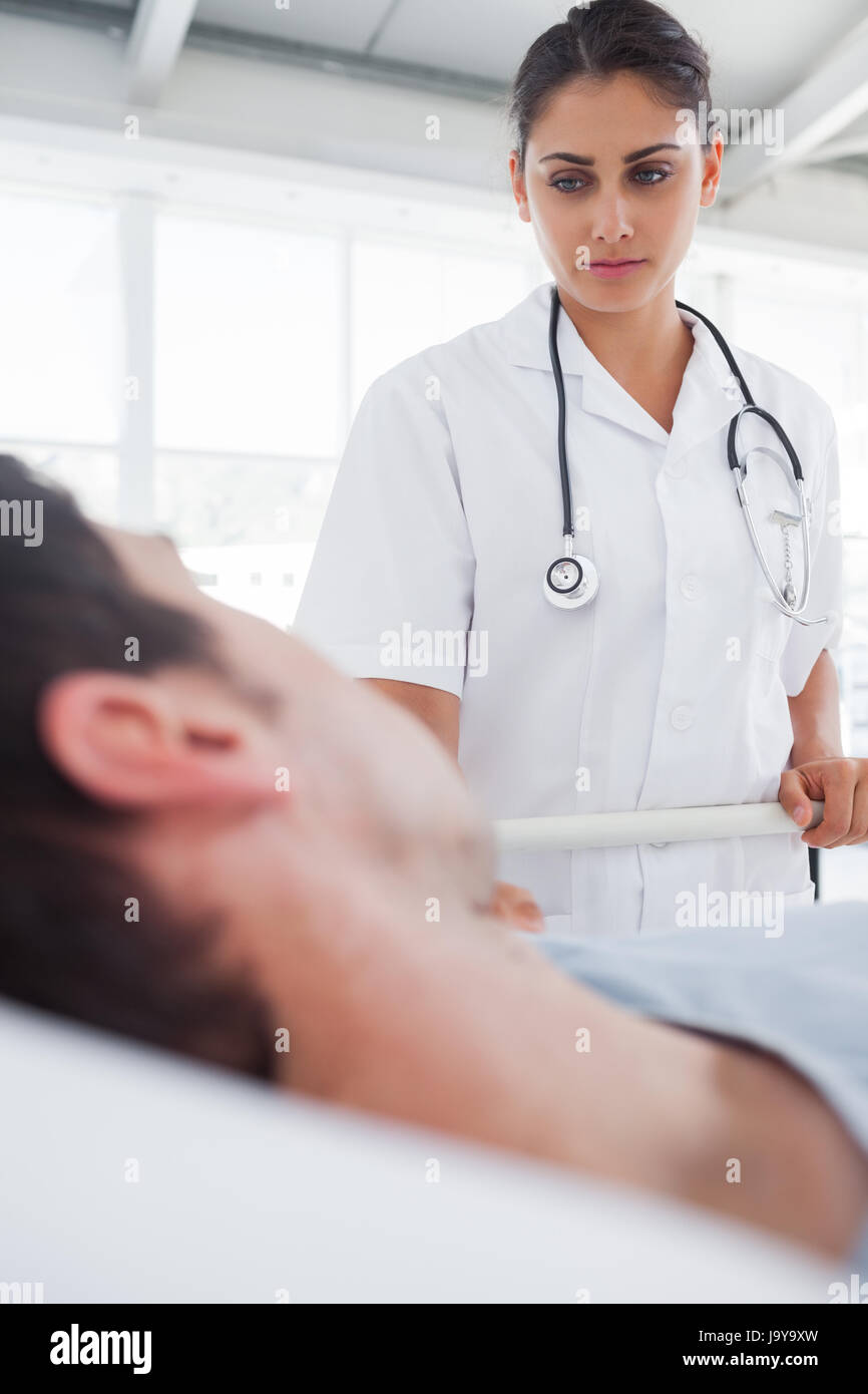 Woman standing over man bed hi-res stock photography and images - Alamy