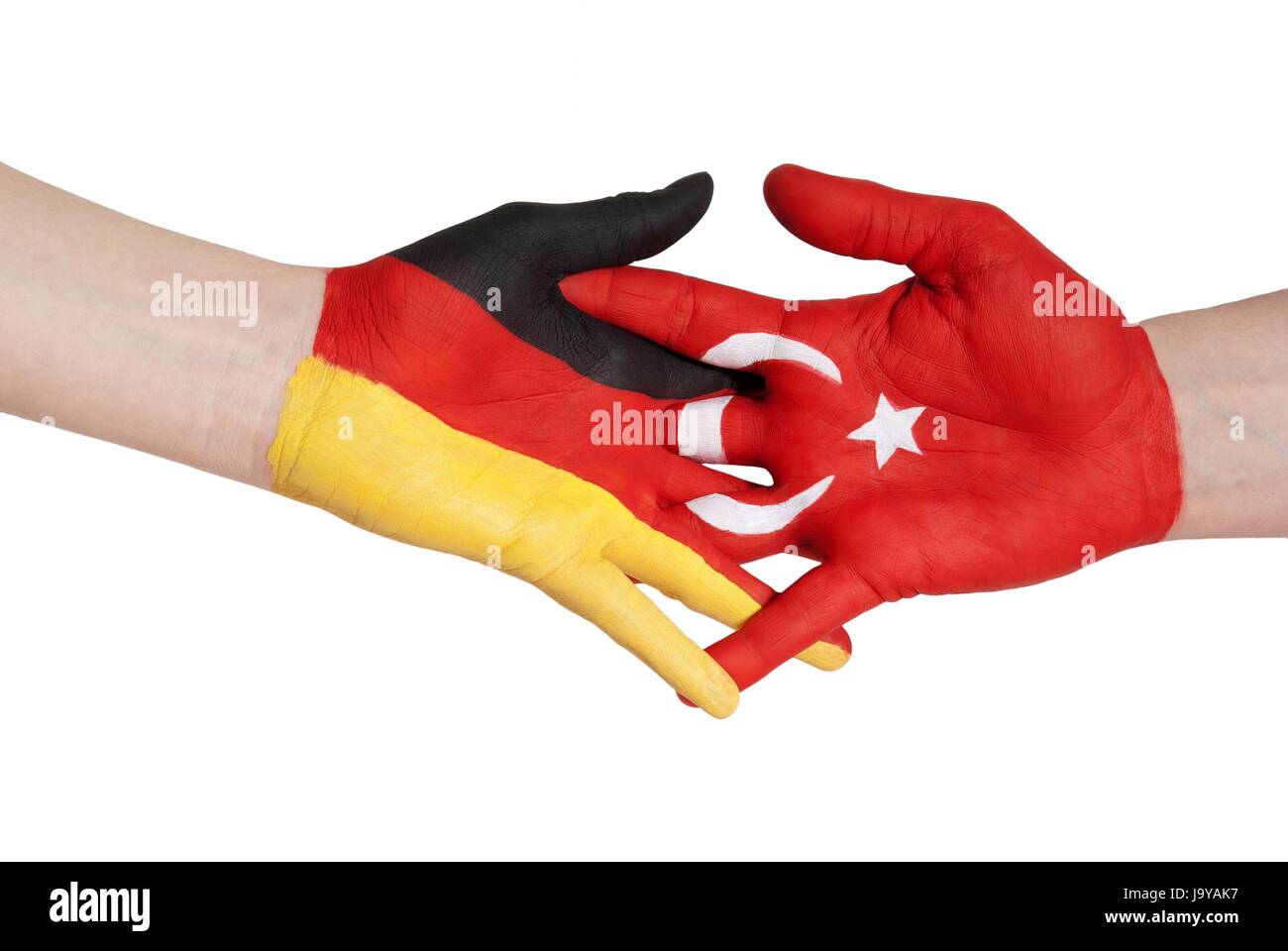 a handshake between turkey and germany, painted on two hands, isolated ...
