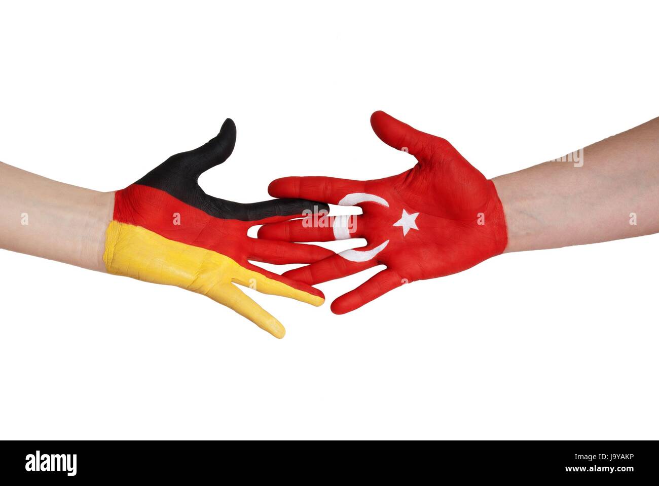 handshaking between a german and a turkey hand, isolated Stock Photo ...