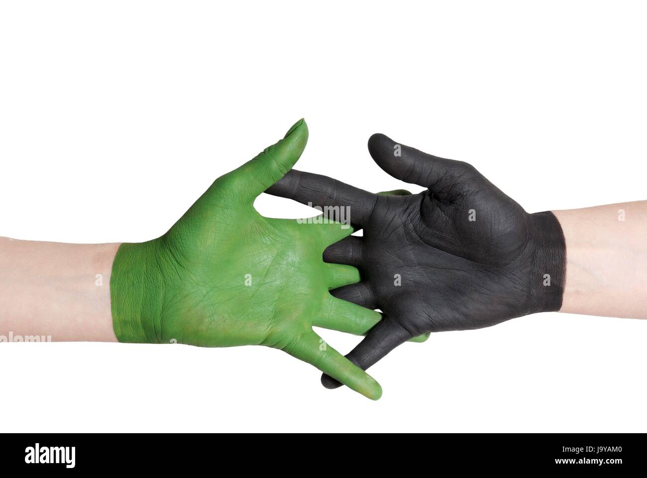a green and a black painted hand giving hands symbolizing team ...
