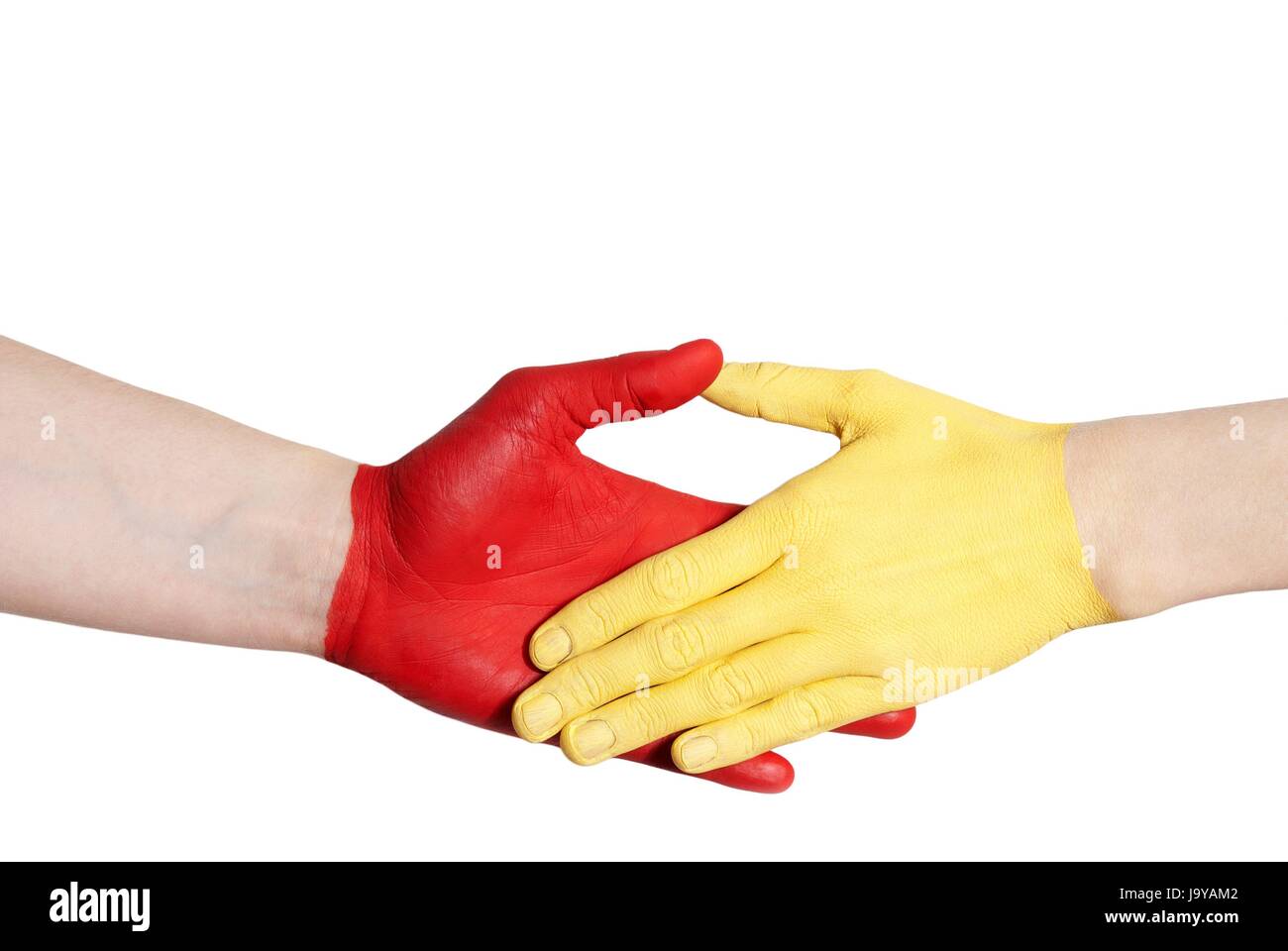 a handshake between a red and a yellow painted hand, isolated Stock ...