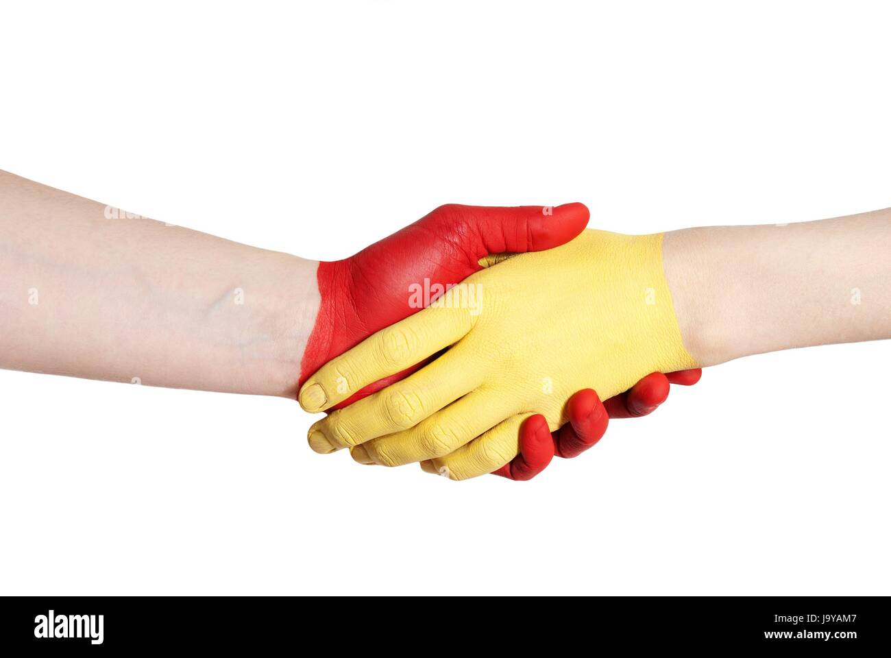 a handshake between a yellow and a red painted hand isolated Stock ...