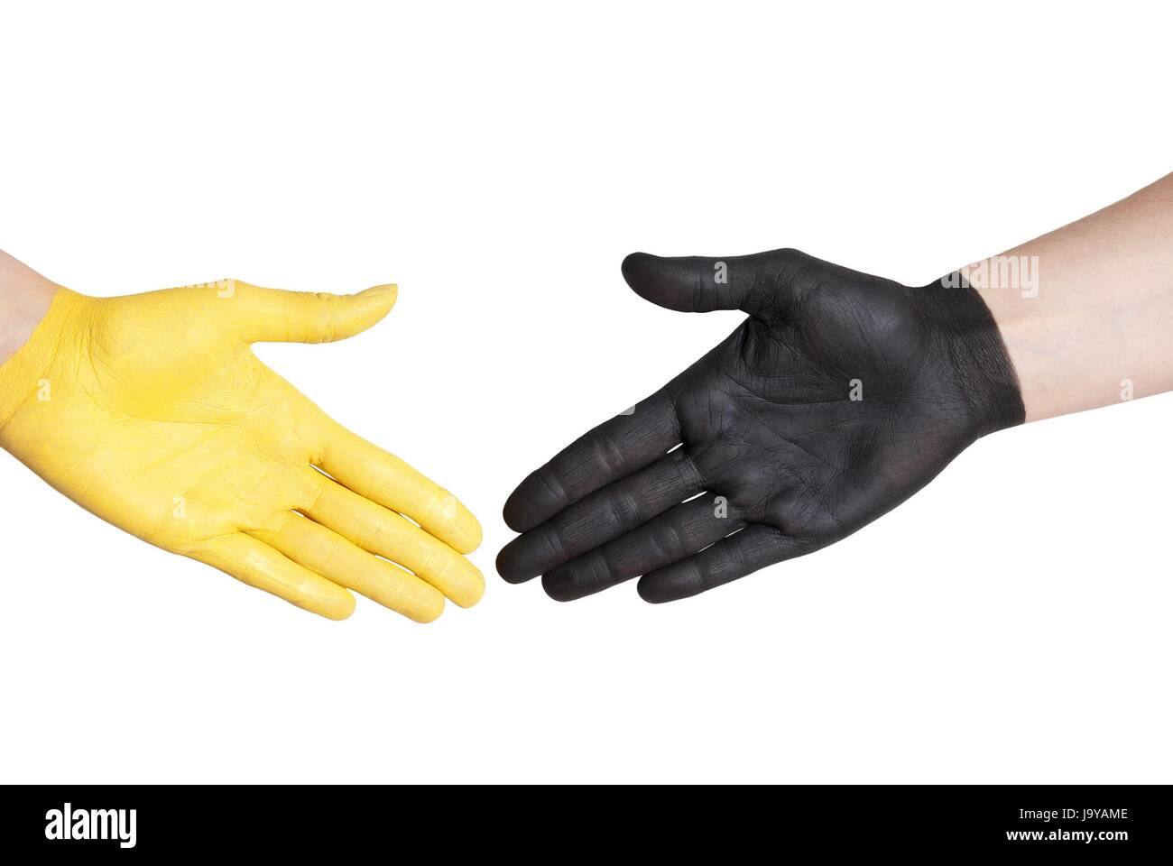 a yellow and a black hand giving hands Stock Photo - Alamy