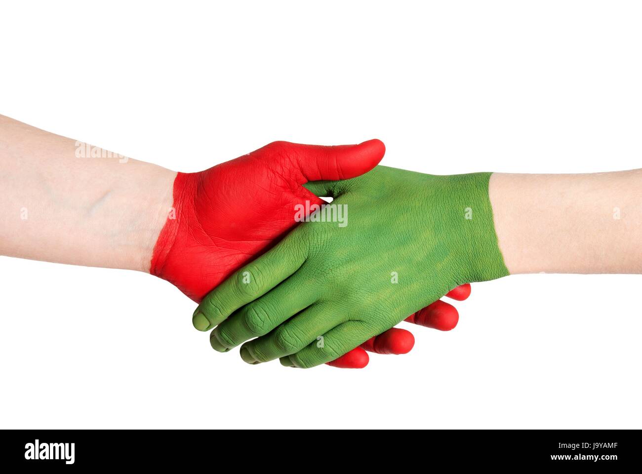 a handshake between a green and a red painted hand, isolated Stock ...