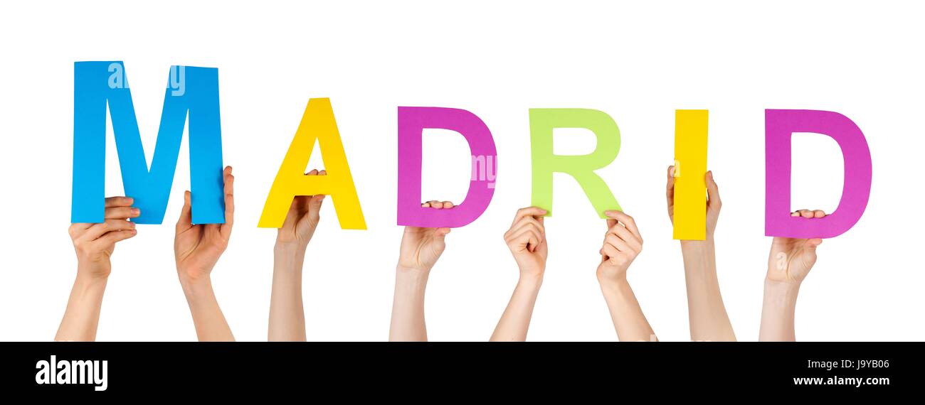 many hands holding the name of the spanish capital Madrid, isolated ...