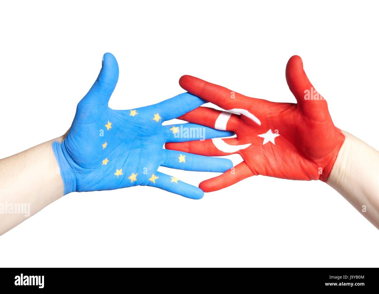 a turkey and a european hand holding each other Stock Photo - Alamy