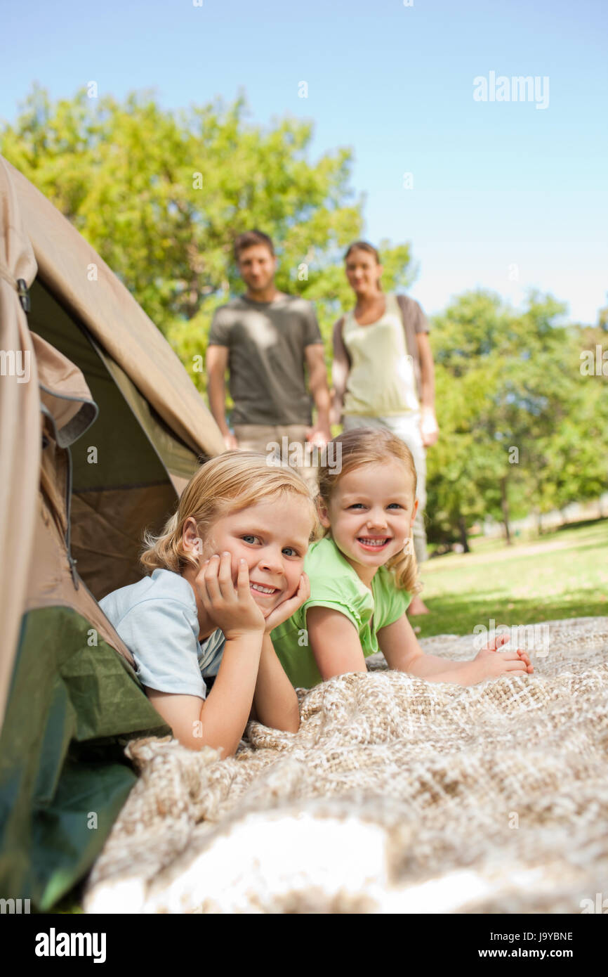 Happy family camping in the park during the summer Stock Photo - Alamy