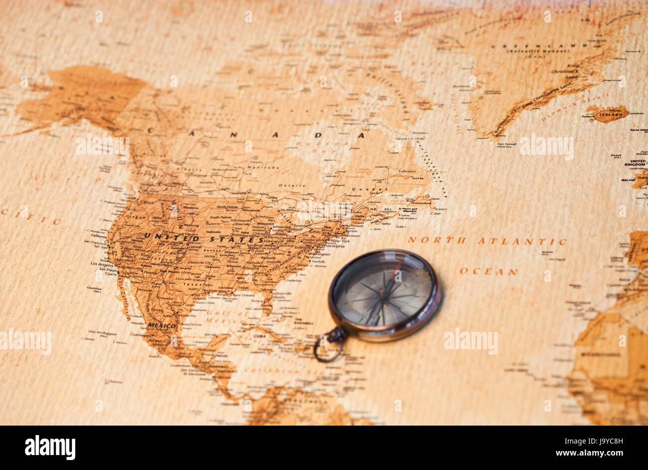 World map with compass showing North America Stock Photo - Alamy
