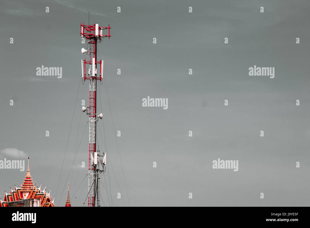 communication tower on blue sky background Stock Photo - Alamy