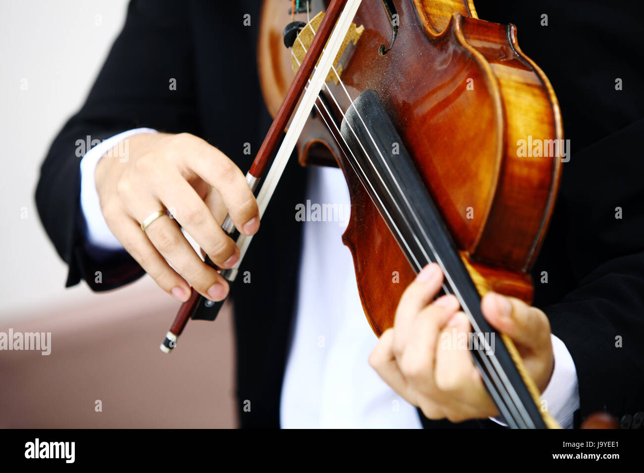 Detail of viola being played by a musician Stock Photo - Alamy