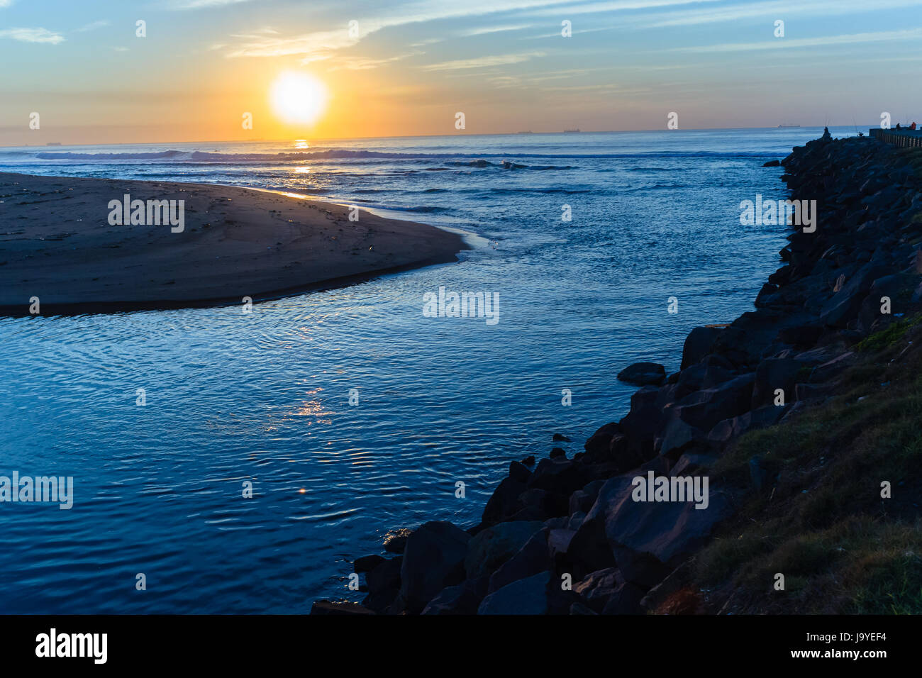 Rivermouth ocean horizon scenic dawn sunrise landscape Stock Photo - Alamy