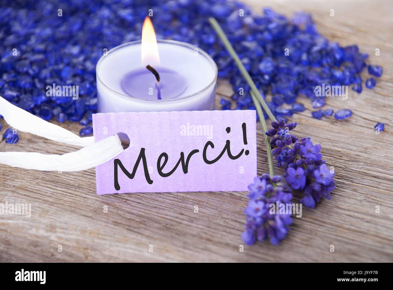 a purple label with the french word merci which means thanks and a ...