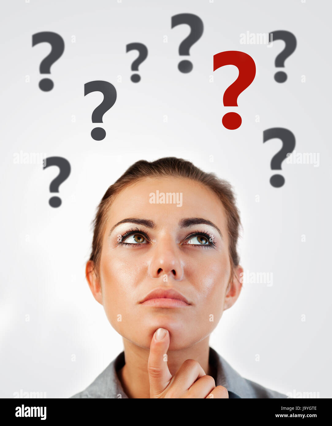 Woman thinking with question marks abover head on white background ...