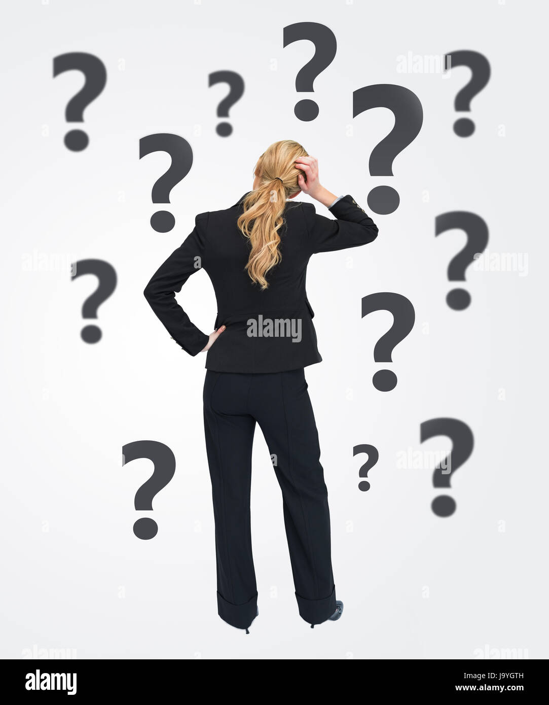 Woman question marks scratching head hi-res stock photography and ...