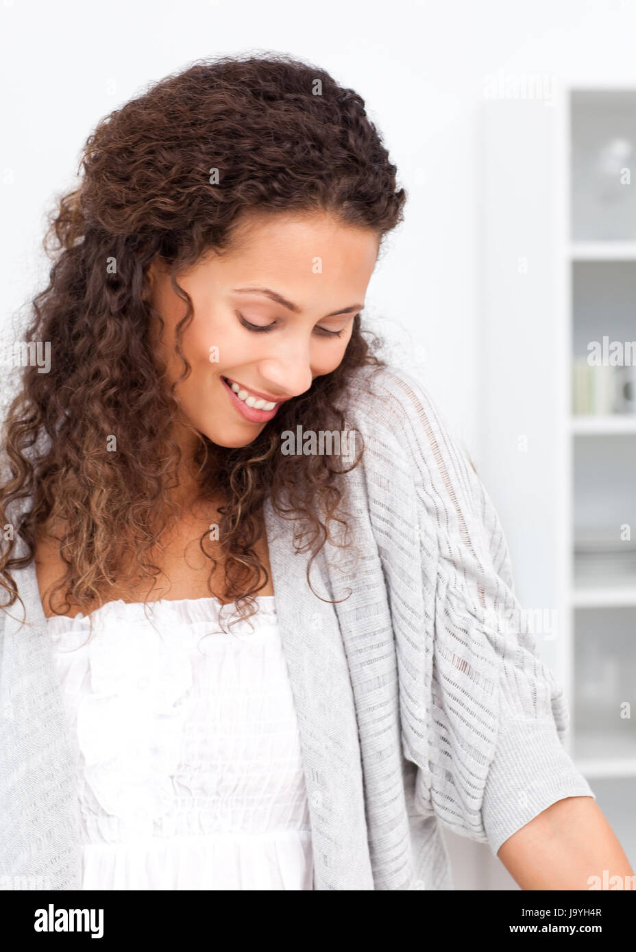 Adorable woman standing in her kitchen at home Stock Photo - Alamy
