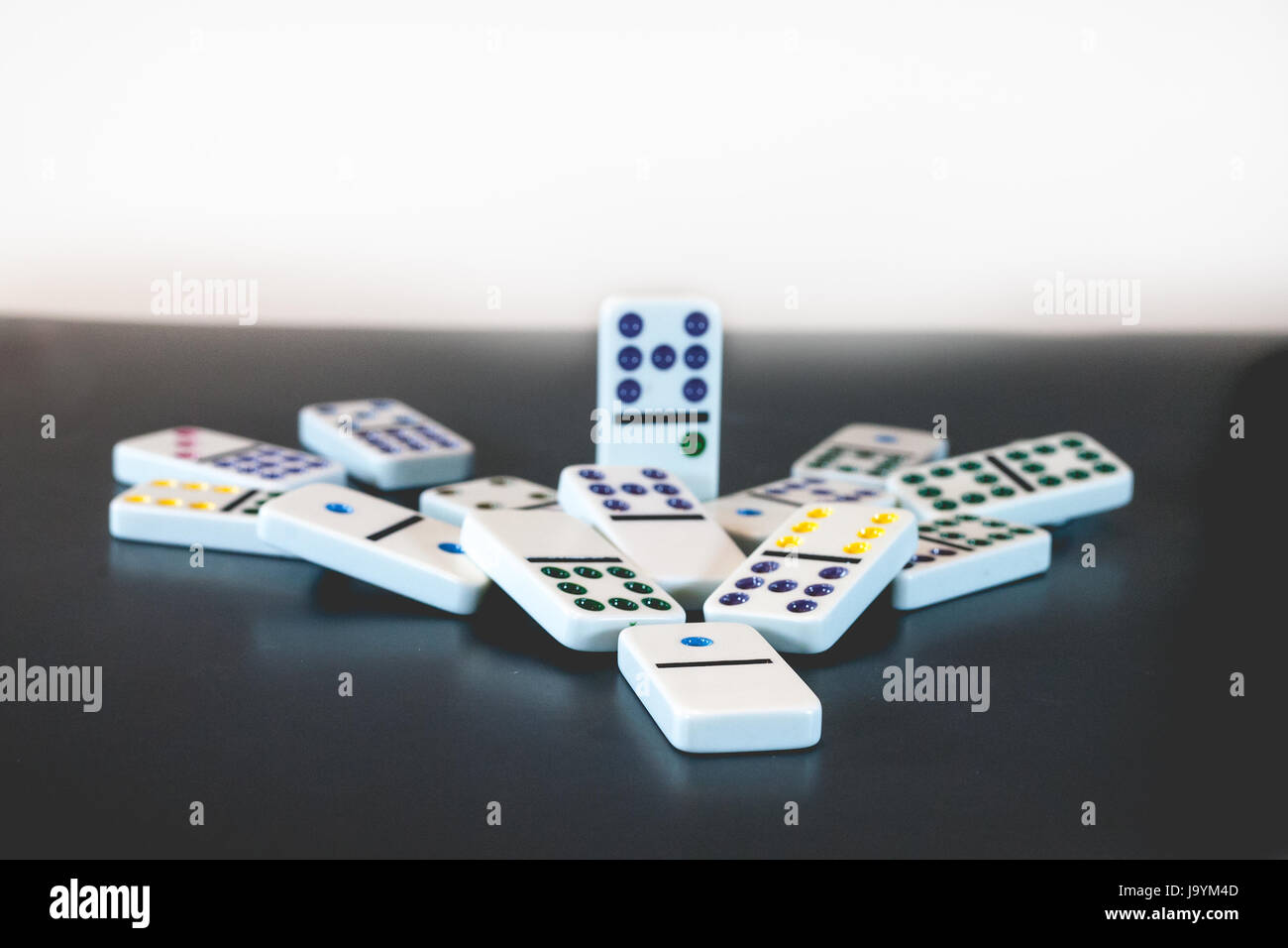 A single domino left standing after all others have fallen Stock Photo ...