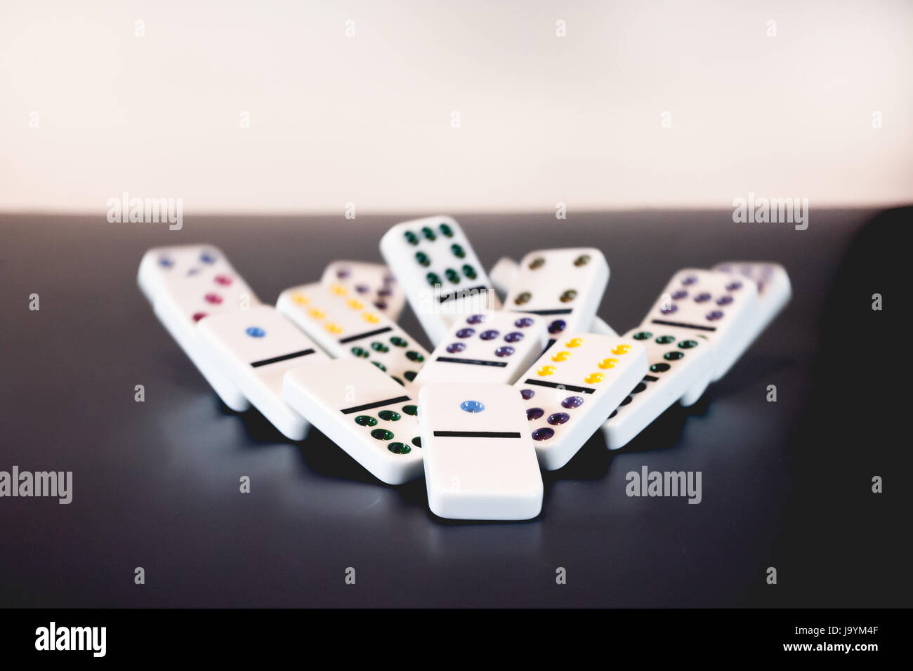 Falling dominos in motion Stock Photo - Alamy