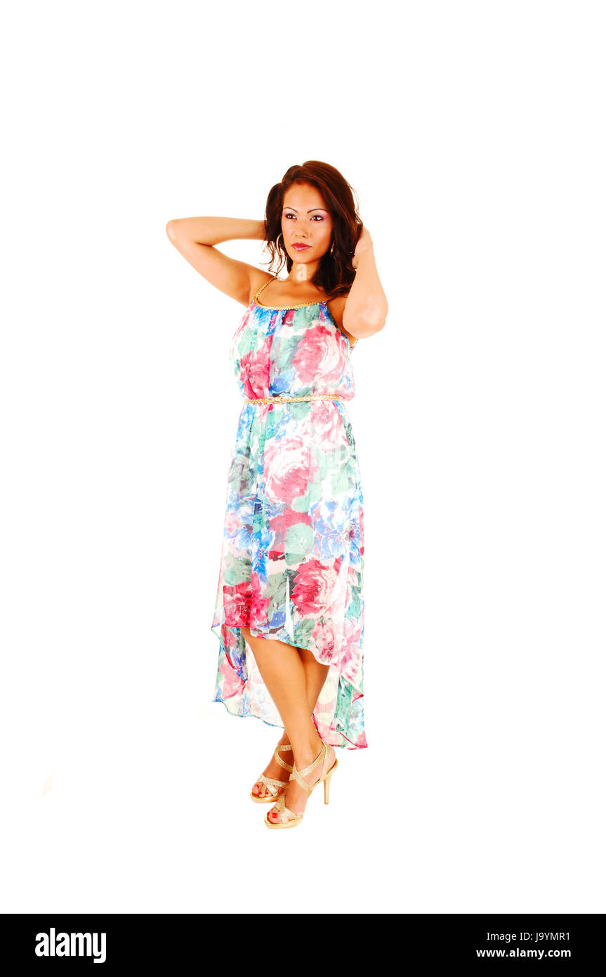 A beautiful native Canadian woman standing in a long colorful summer ...