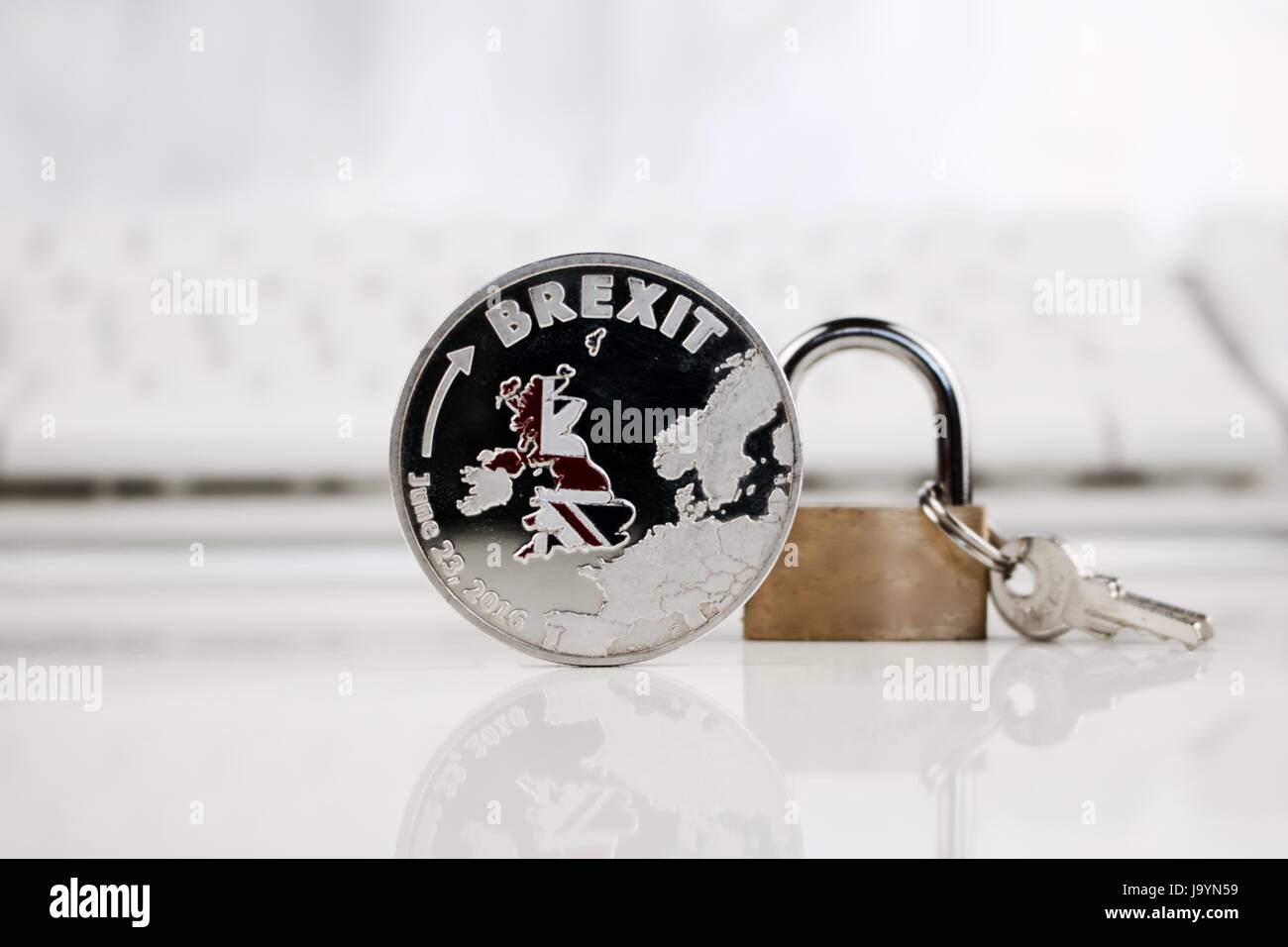 Physical silver brexit coin near gold padlock Stock Photo - Alamy
