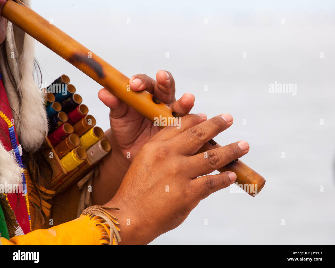 Indian man playing flute street hi-res stock photography and images - Alamy