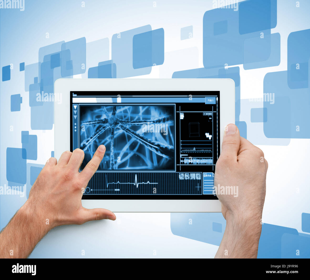 Hand holding and touching a medical digital tablet on a digitally ...