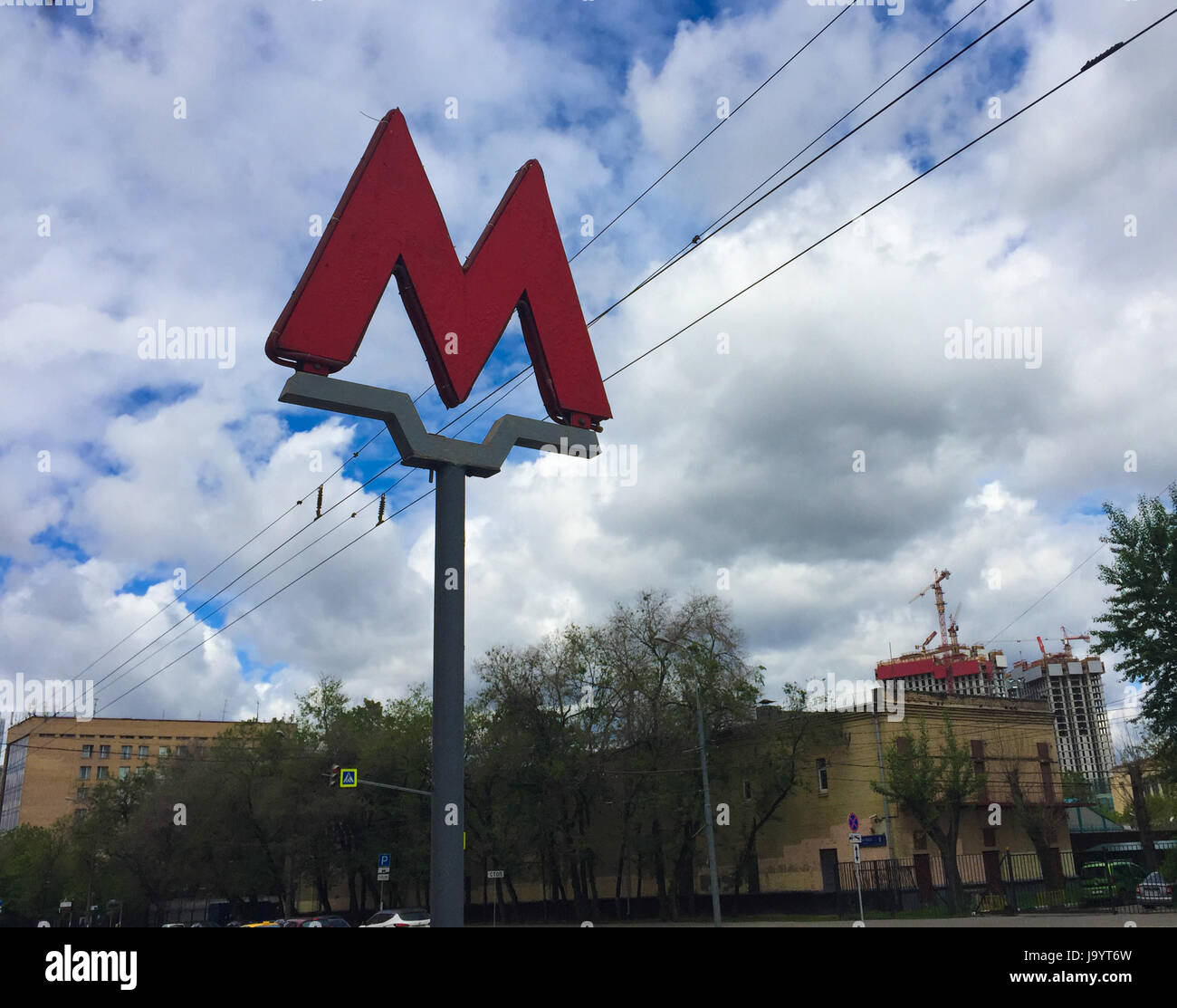 M-symbol of the metro against the sky and buildings Stock Photo - Alamy