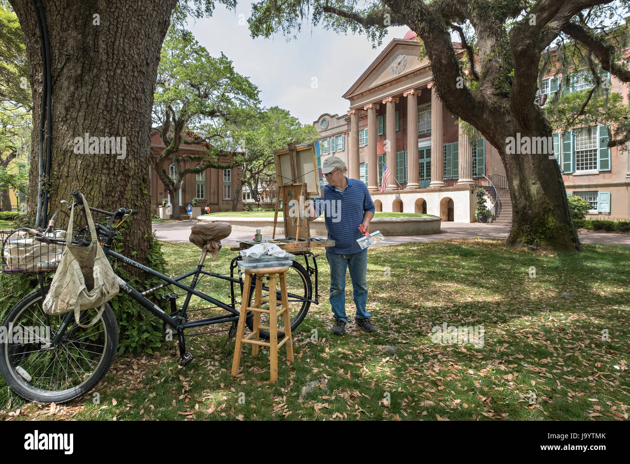 Artist David Anthony Babb known as DAB works on a painting using his ...