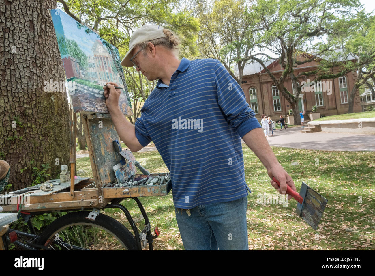 Artist David Anthony Babb known as DAB works on a painting using his ...