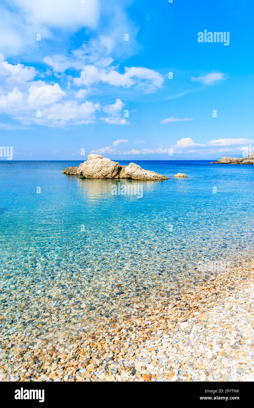 Beautiful pebble stone beach with rocks in Kokkari village on sunny ...