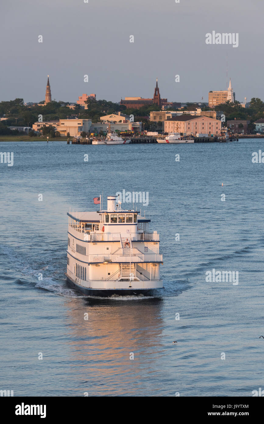 Sunset tour boat Spirit of Carolina crosses the Ashley River with the ...