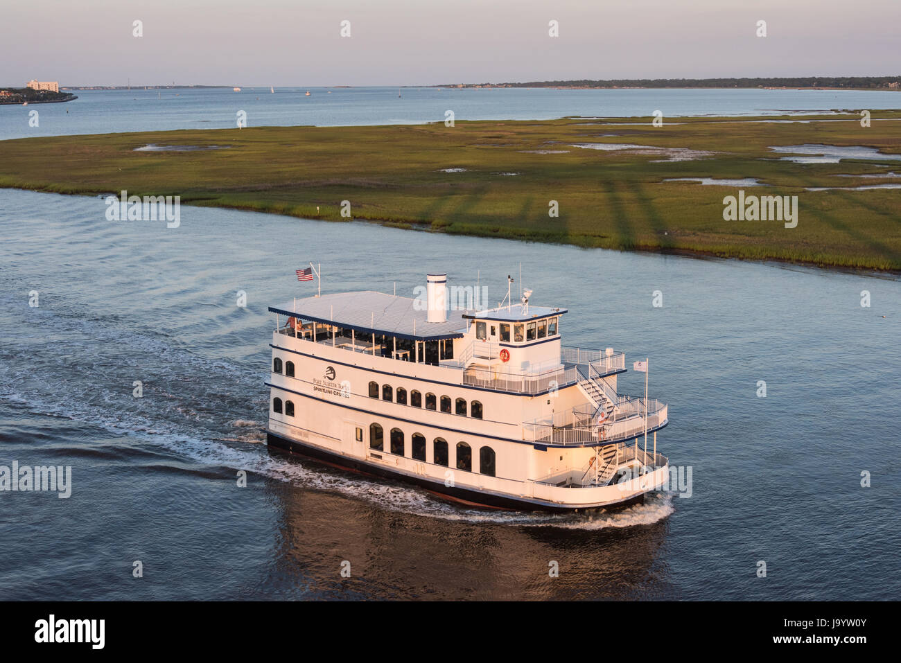 Sunset tour boat Spirit of Carolina crosses the Ashley River past the ...