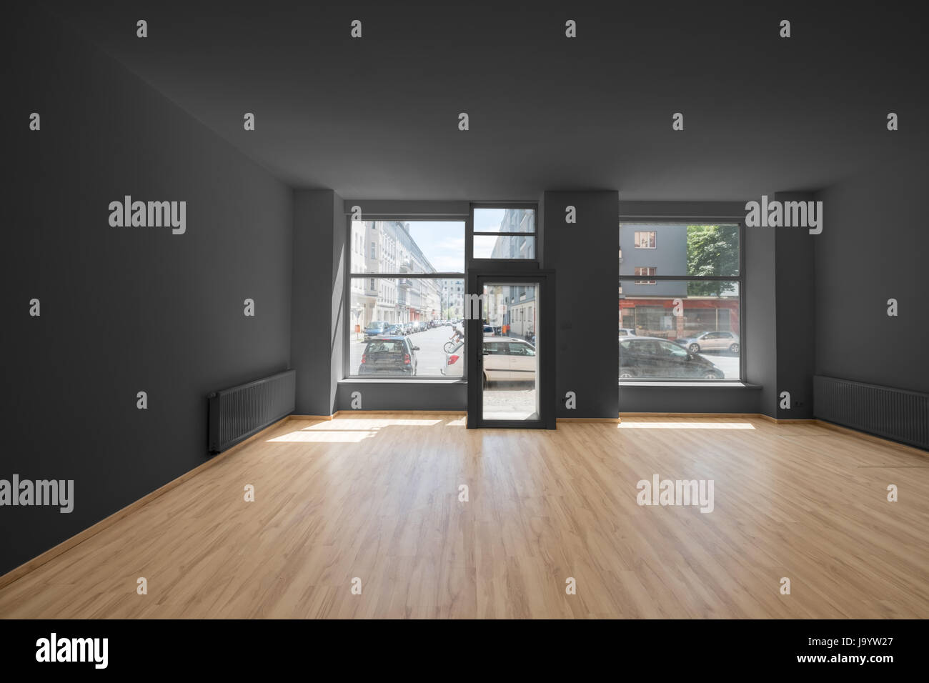 renovated showroom / shop - empty room with wooden floor and shopping ...