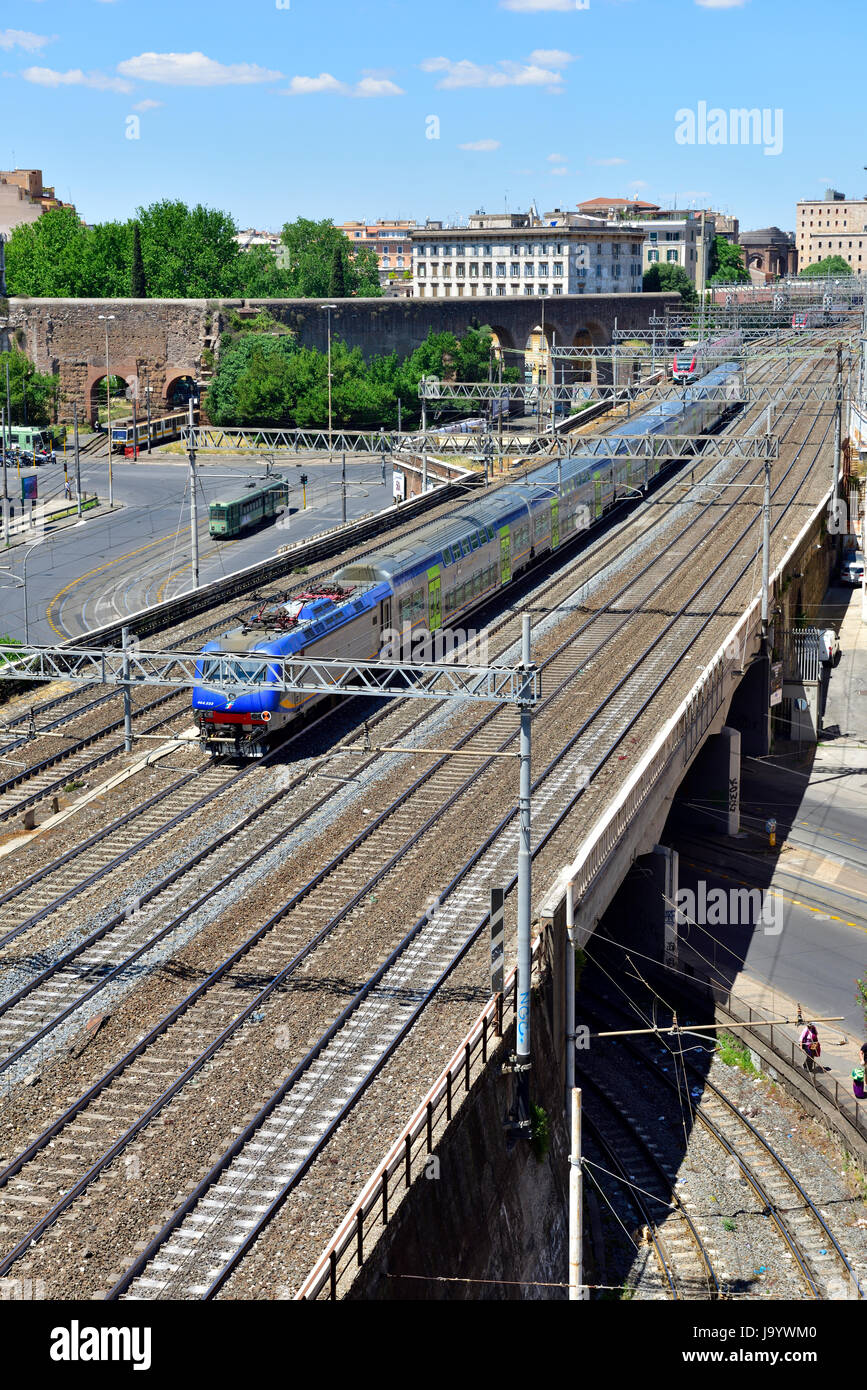 Electrified rail lines in Rome, mainline train on elevated tracks and ...