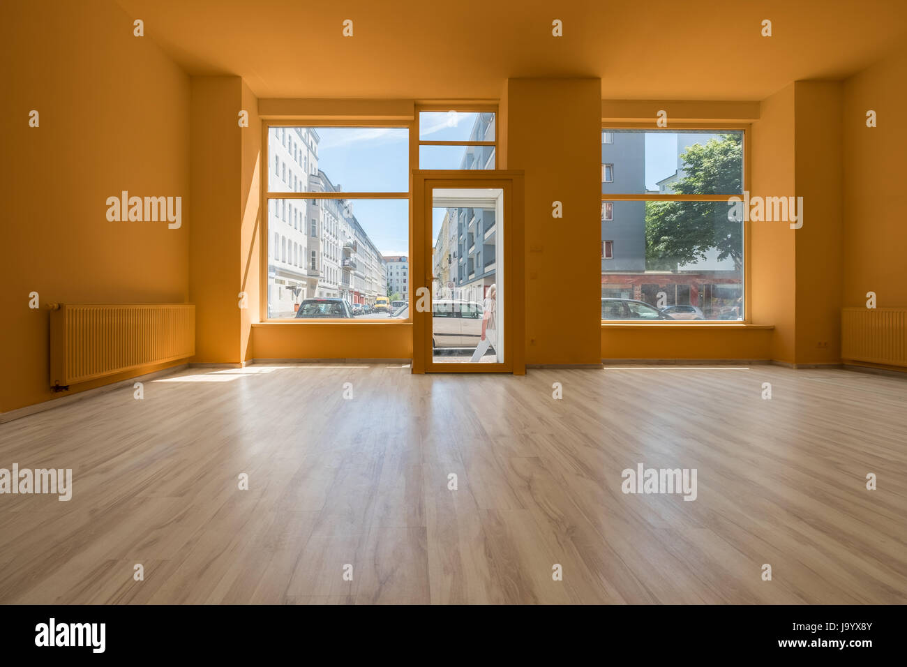 renovated showroom / shop - empty room with wooden floor and shopping ...