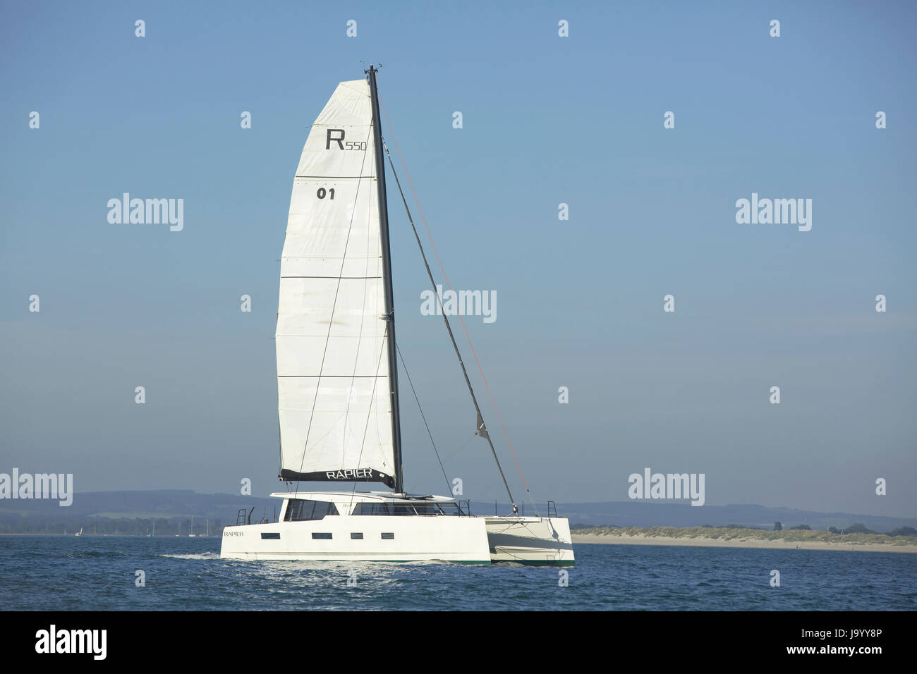 Rapier 550 a sleek modern catamaran leaving Chichester harbour. Fast ...