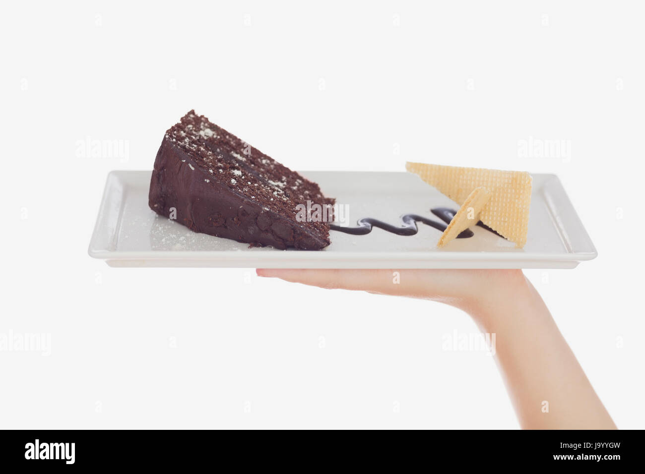 Closeup of hand holding pastry plate over white background Stock Photo ...