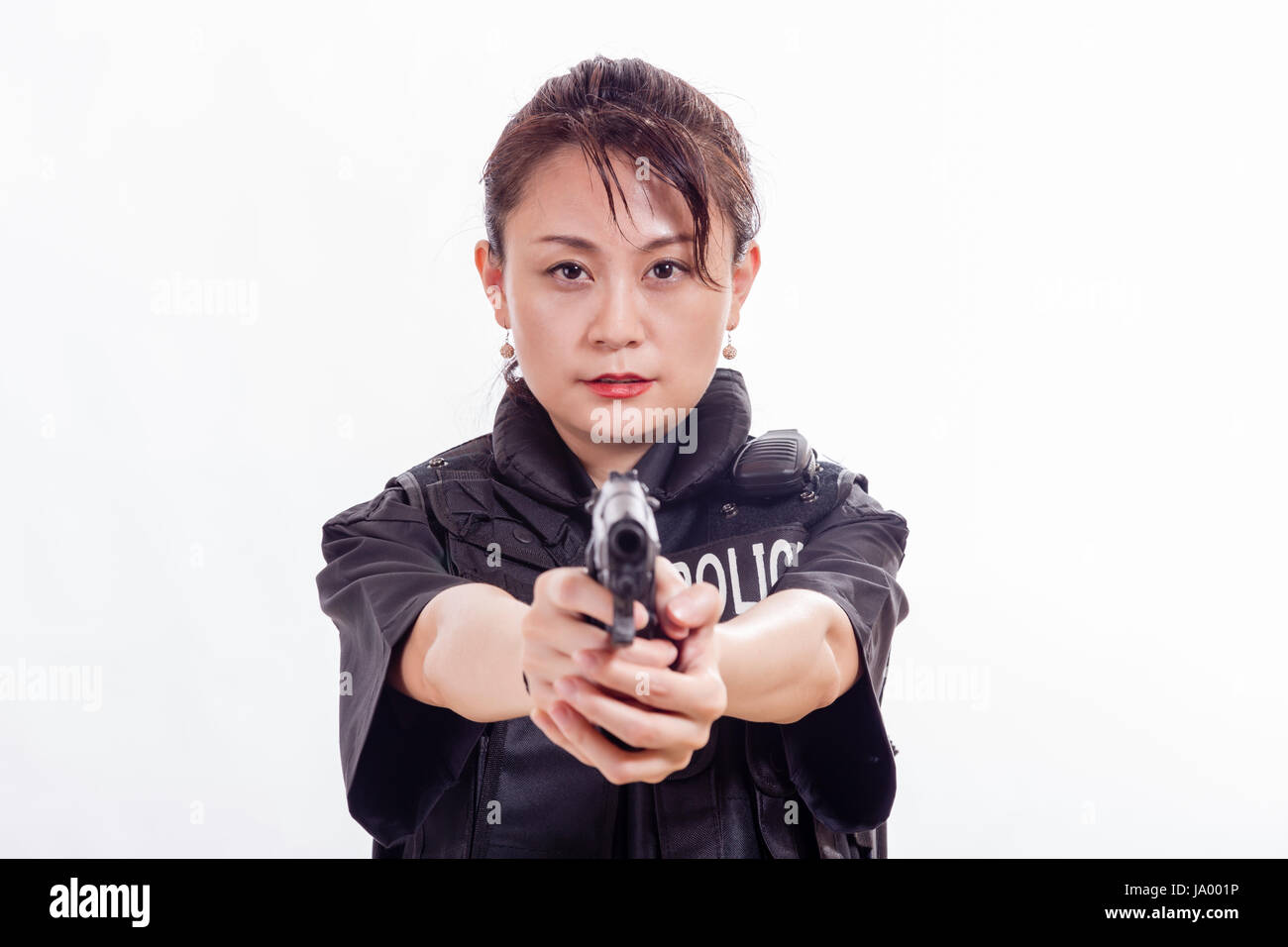 Chinese female police officer pointing handgun Stock Photo - Alamy