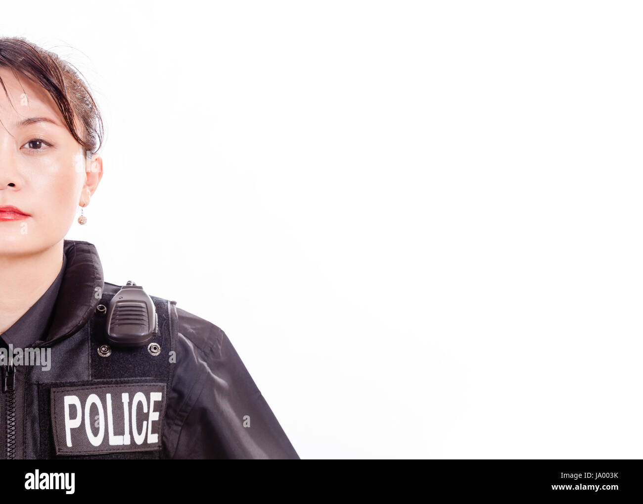 Chinese female police officer, half head and shoulder with copy space ...